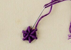 Whipped spider wheel: Library of Embroidery Stitches